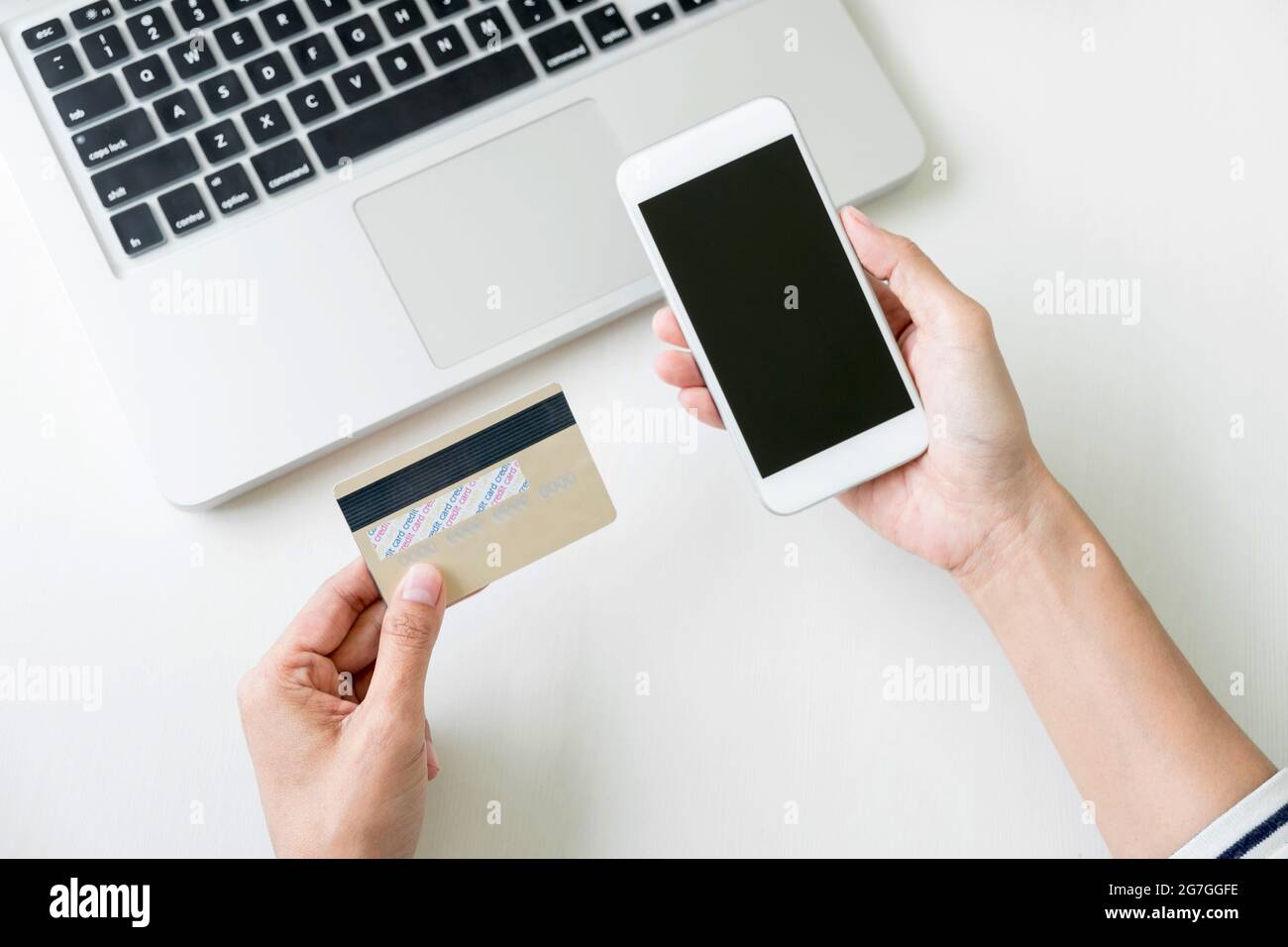 Happy Woman using smart phone and credit card register payments online ...