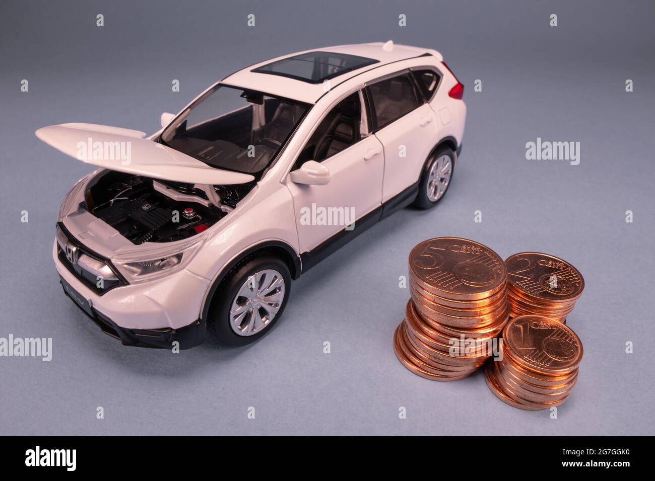 Miniature car model and Financial statement with coins. Finance and car ...