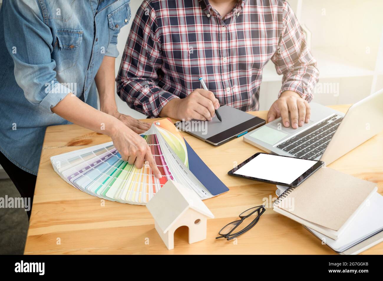 Young colleagues designers working together on a creative project and ...