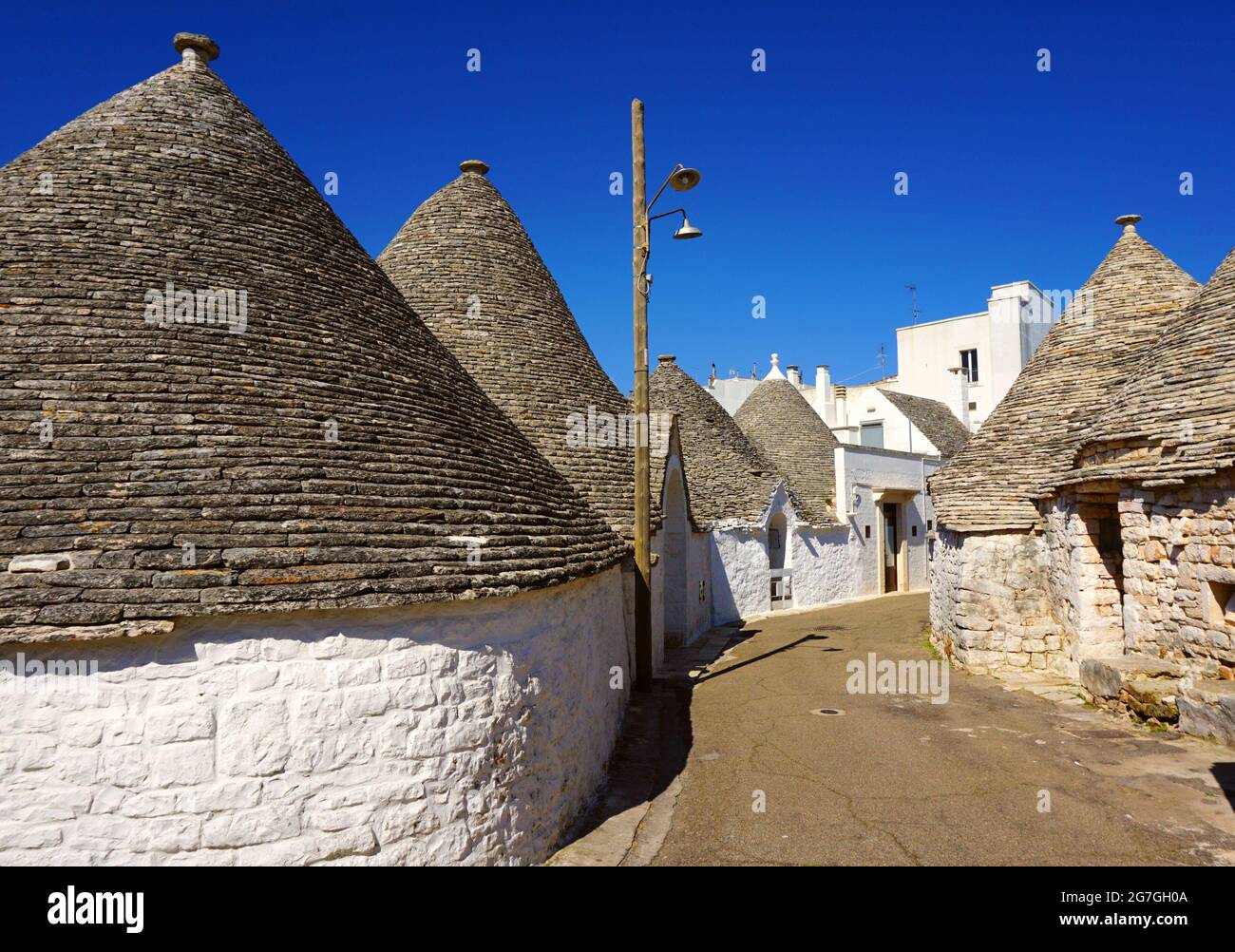 A trullo (plural, trulli) is a traditional Apulian dry stone hut with a ...