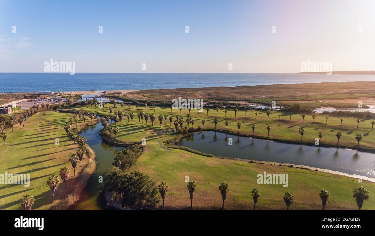 Green golf courses by the sea. Salgados beach. Portugal, Albufeira ...