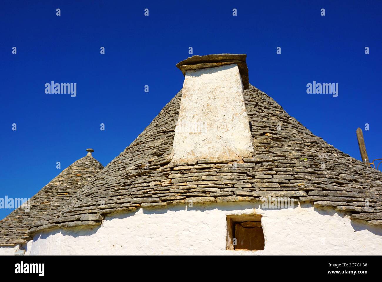 A trullo (plural, trulli) is a traditional Apulian dry stone hut with a ...