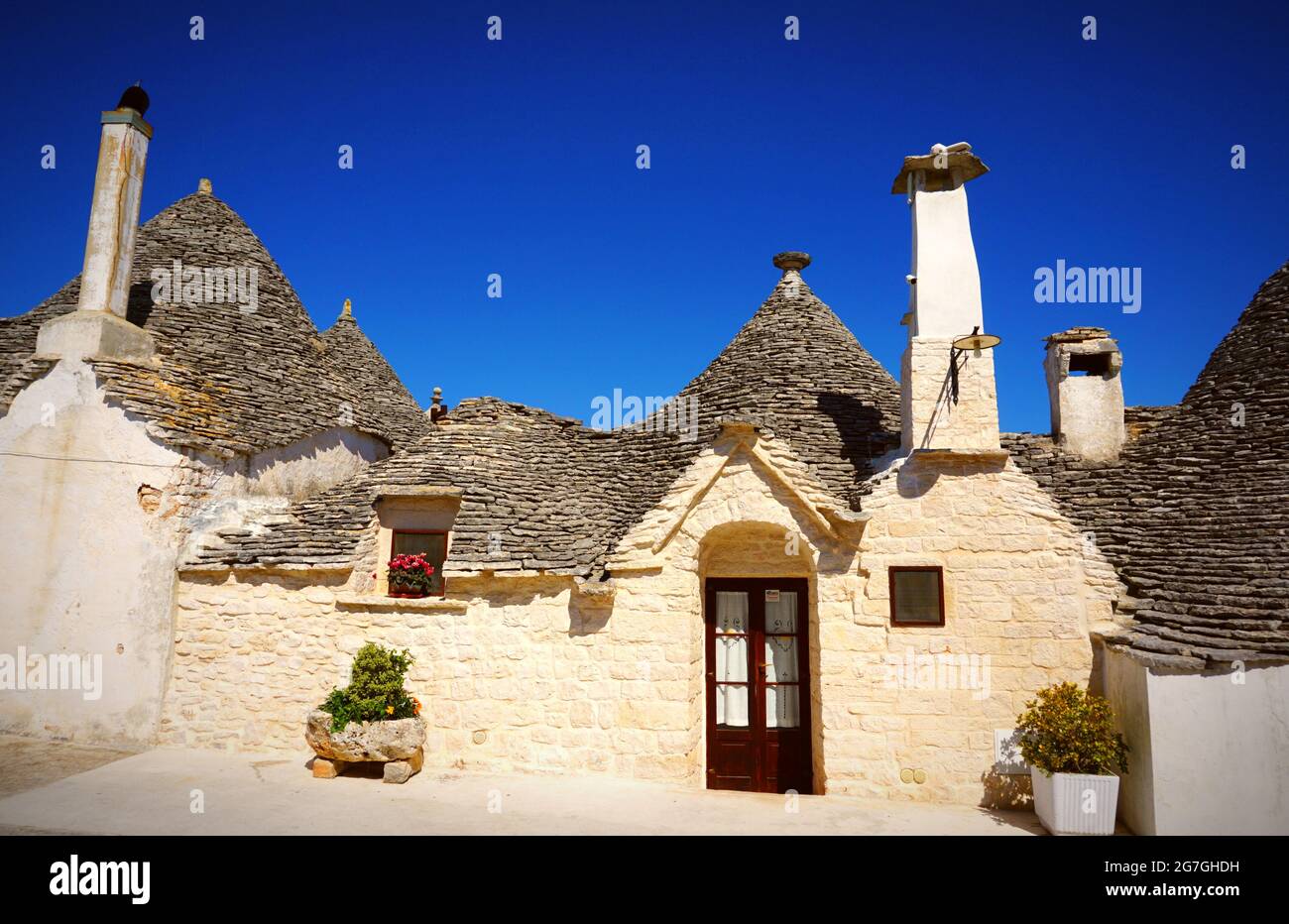 A trullo (plural, trulli) is a traditional Apulian dry stone hut with a ...