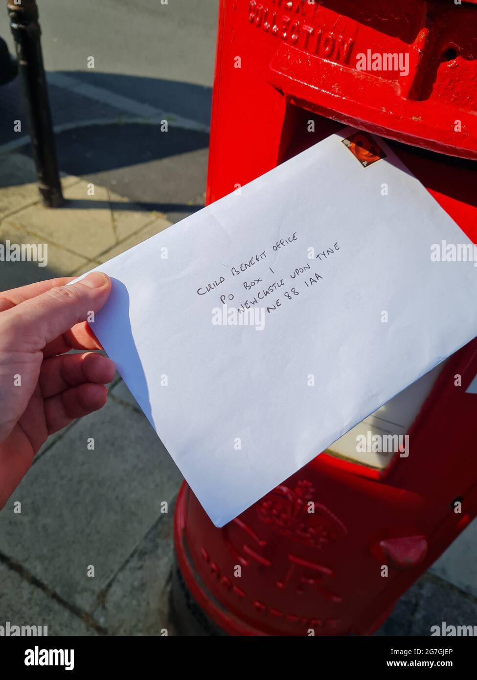 man posting a letter to the child benefit office in the uk Stock Photo ...