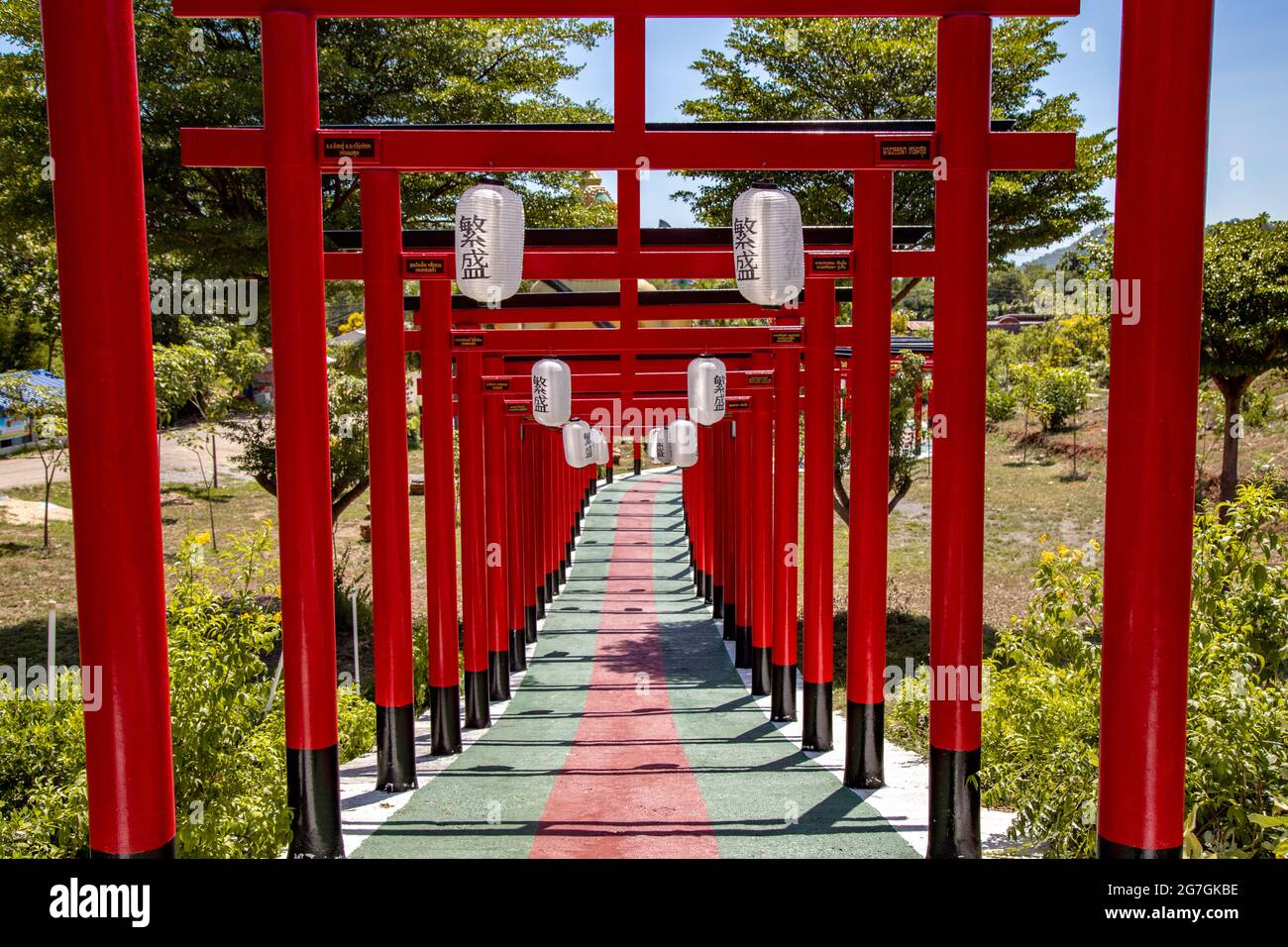 Wat Khao Sung Chaem Fa temple with giant snake and reclining gold ...