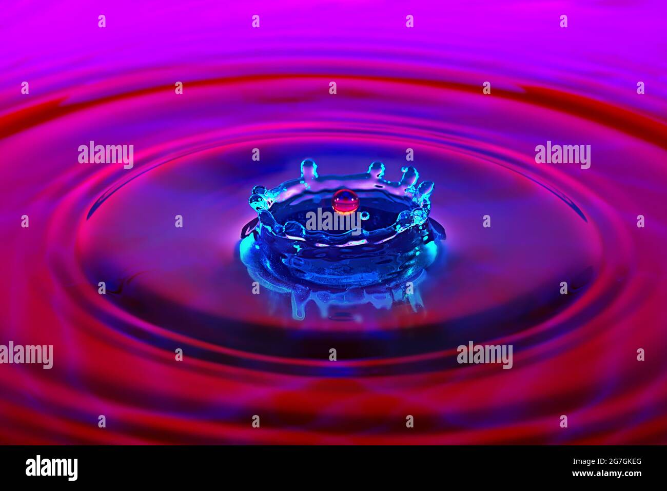 Abstract color drop with splashes Stock Photo - Alamy