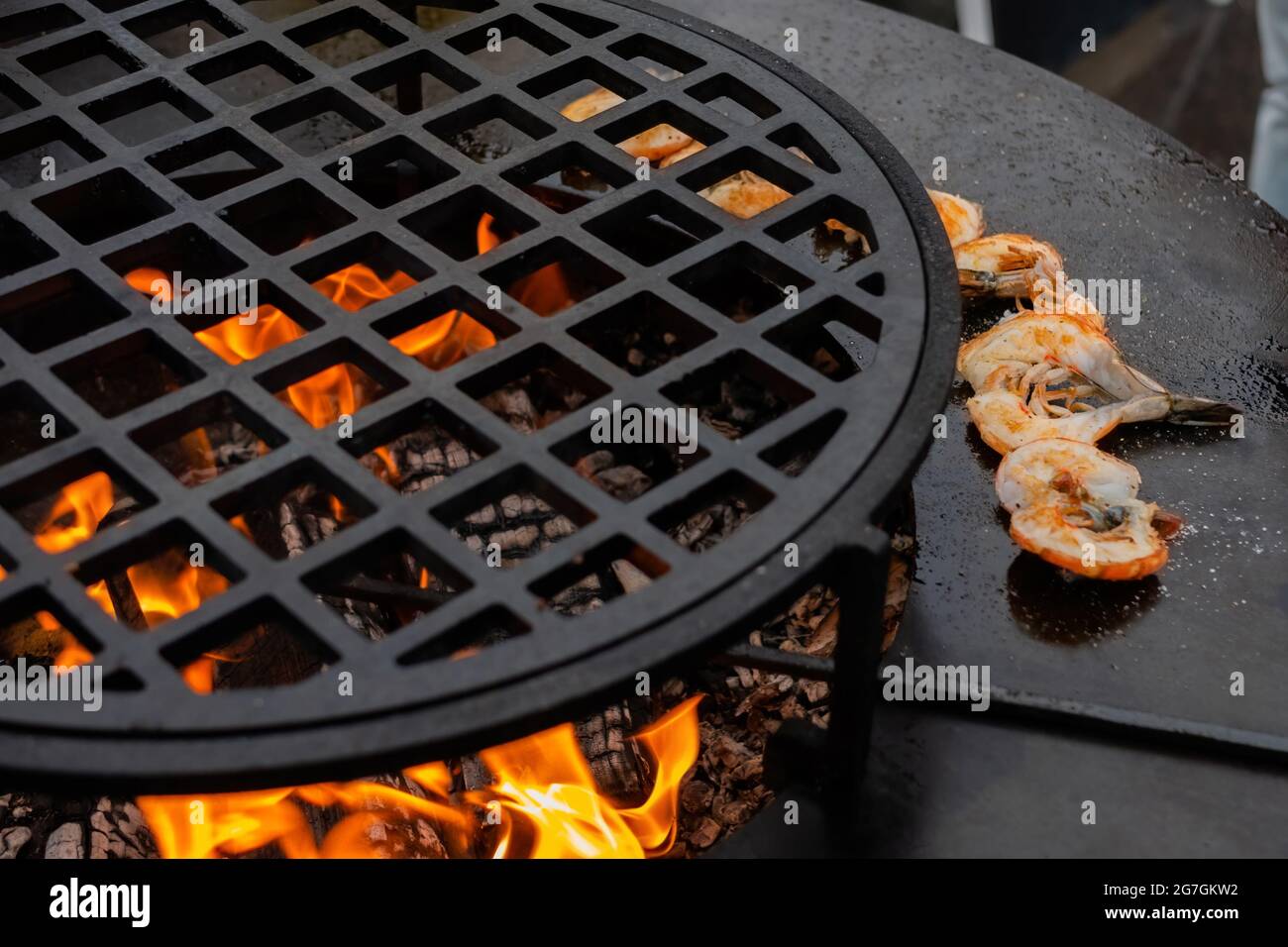 Process of grilling red prawns on brazier with hot flame - close up ...