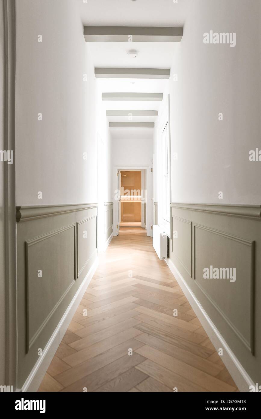 A long empty corridor designed in minimalistic style Stock Photo - Alamy