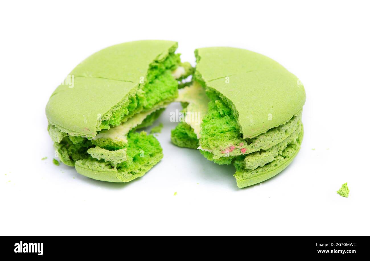 One green macaroon isolated on white background, colorful french ...