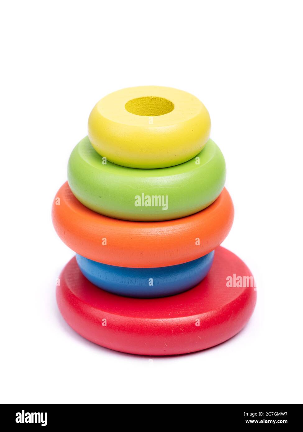 Childs wooden multi-colored toy composite pyramid isolated on whute ...