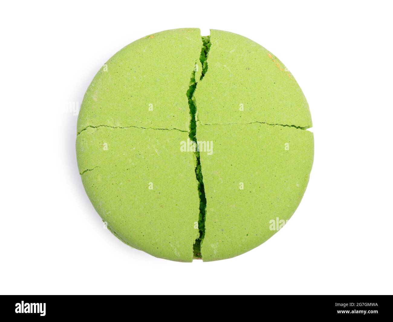 One green macaroon isolated on white background, colorful french ...