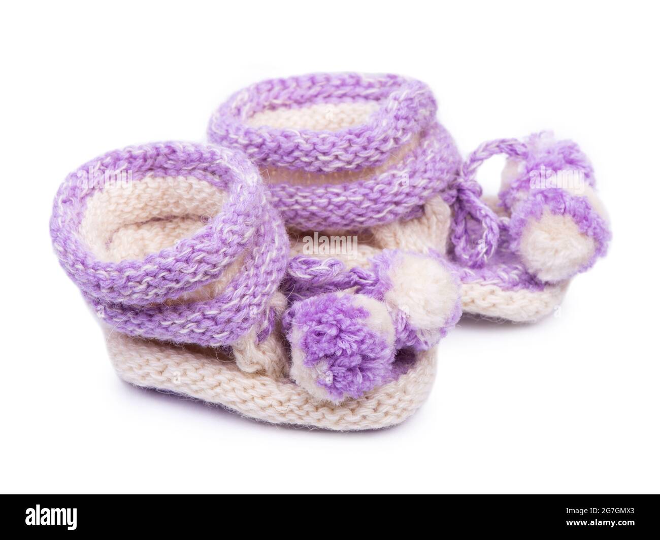 Pair of baby bootees isolated on white background Stock Photo - Alamy