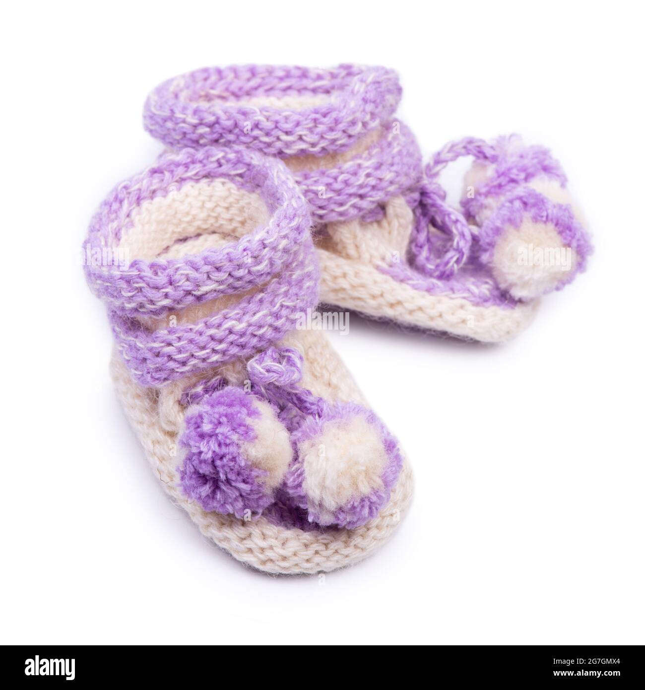 Pair of baby bootees isolated on white background Stock Photo - Alamy