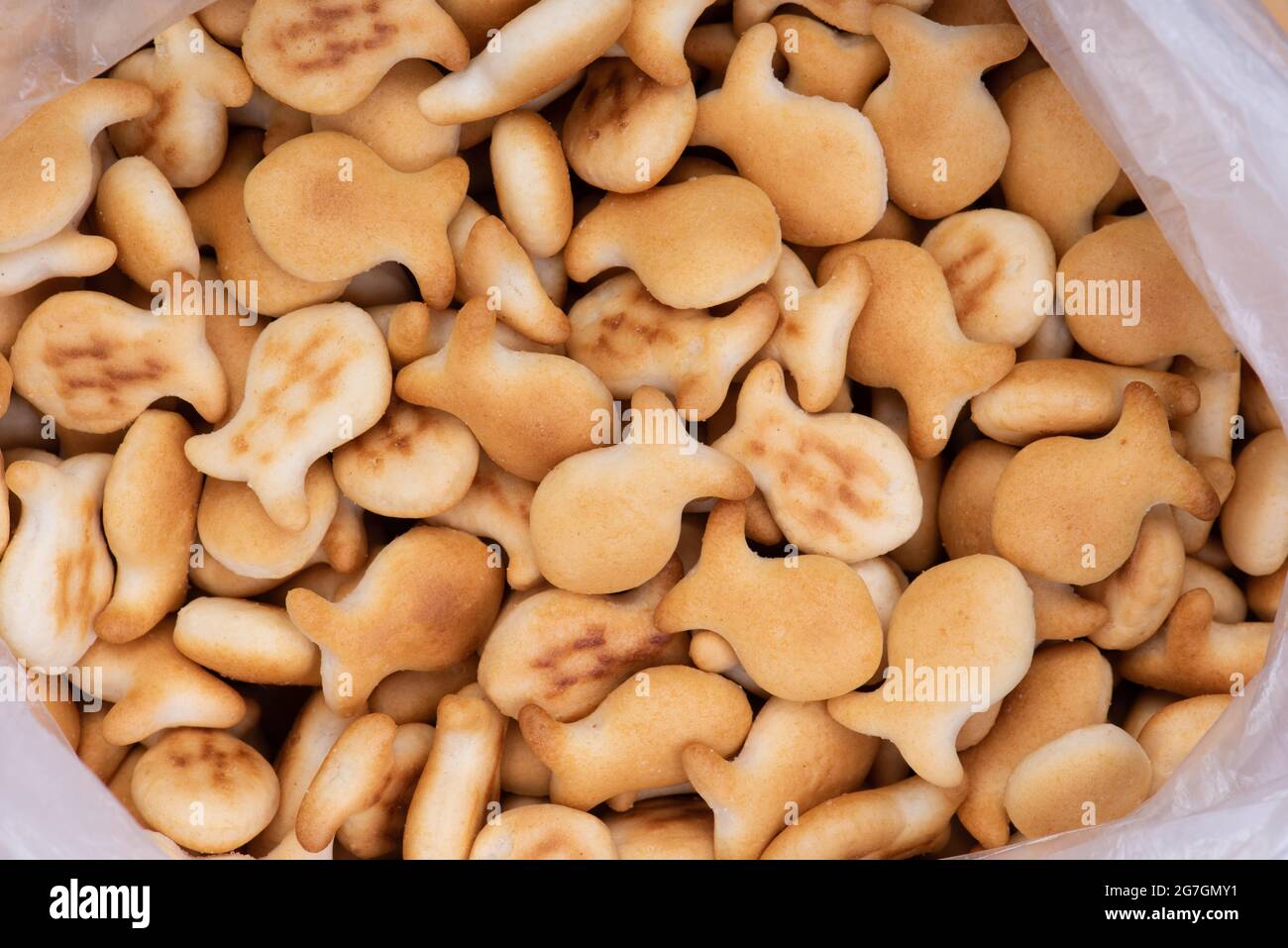 Top view of cookies in fish shape at the plastic bag, food background ...