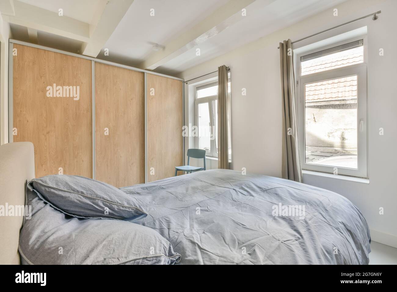 Side view of a large bed with soft pillows Stock Photo - Alamy