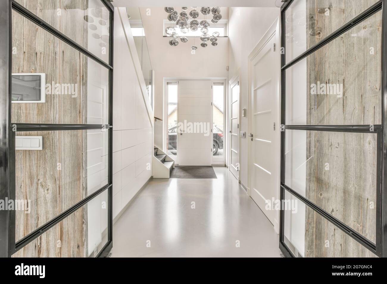 From inside a luxury home a long empty corridor design in minimalist ...