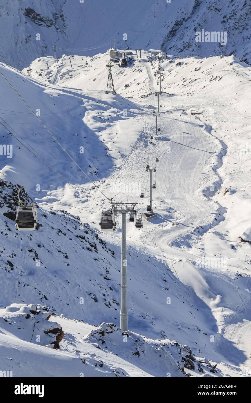 Cable car with cabins in a snow-covered ski resort. The concept of ...