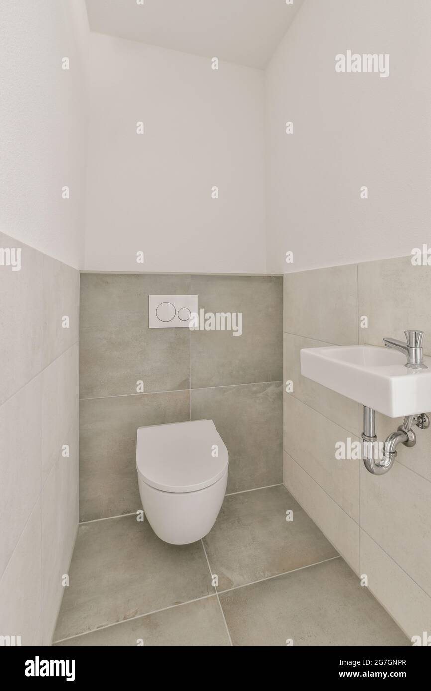 Interior of small clean washroom in miniature style Stock Photo - Alamy