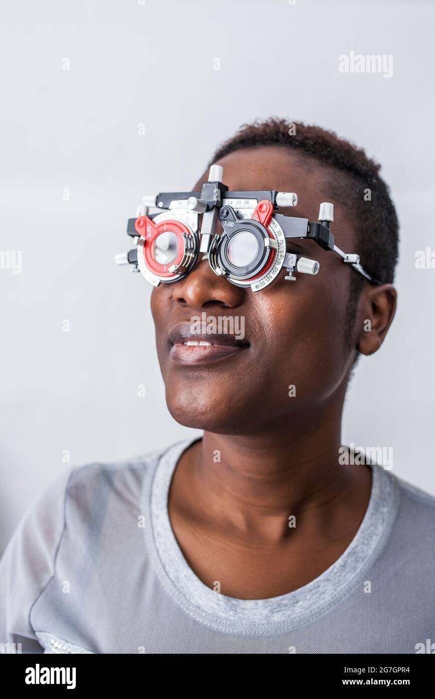 Black Woman in optometry cabinet during study of the eyesight Stock ...