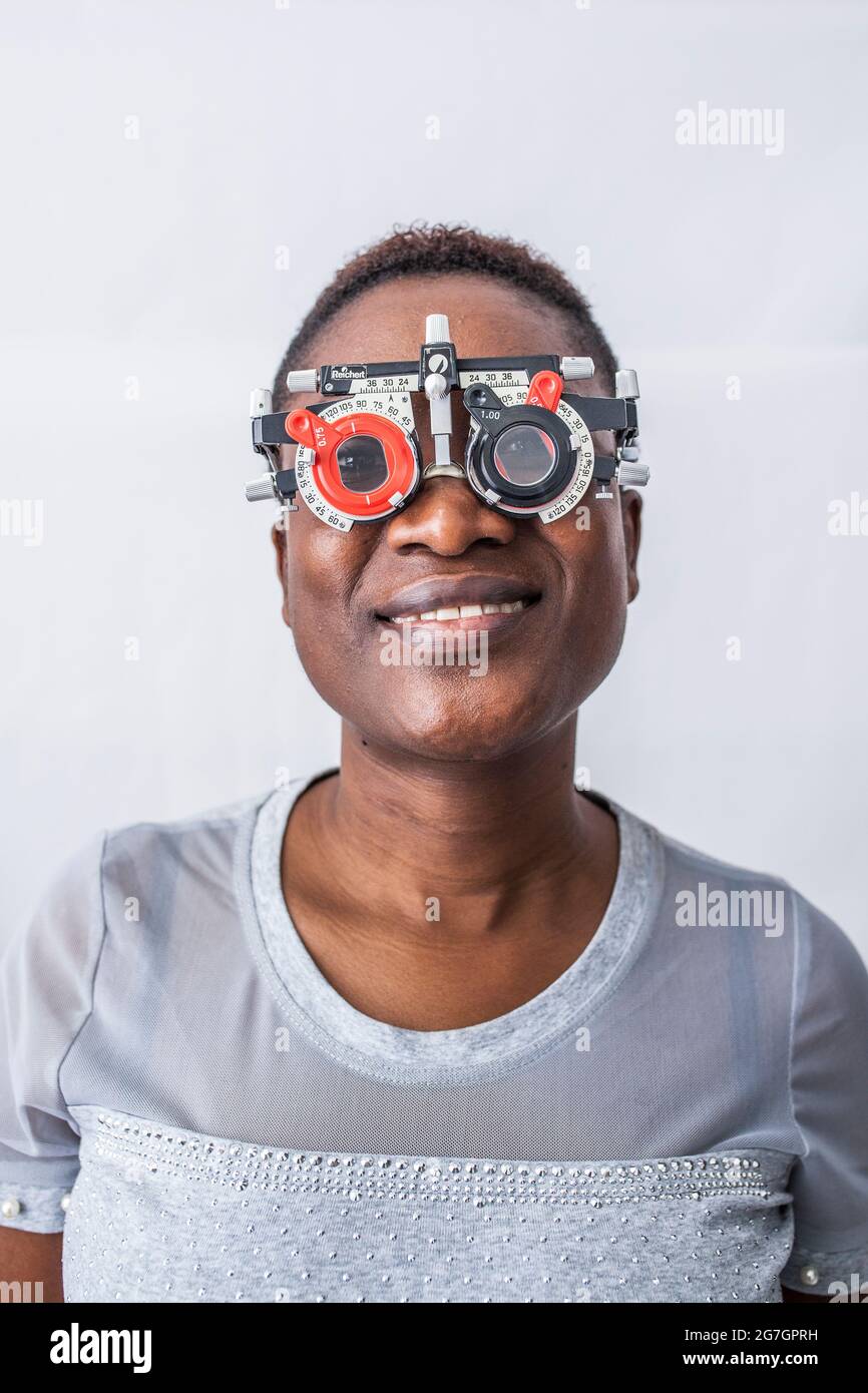 Black Woman in optometry cabinet during study of the eyesight Stock ...