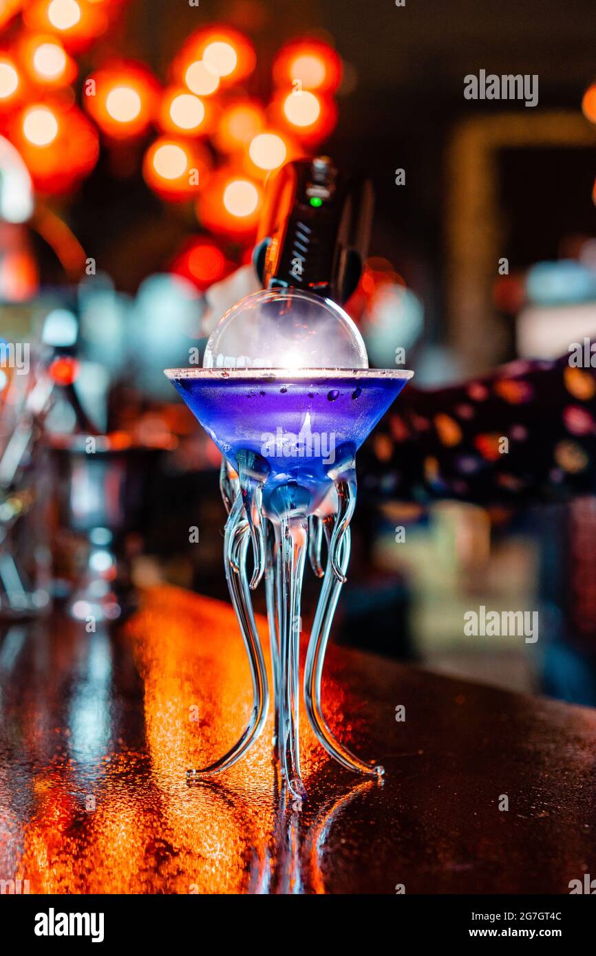 Low angle of refreshing flavor blaster cocktail in glass served on ...