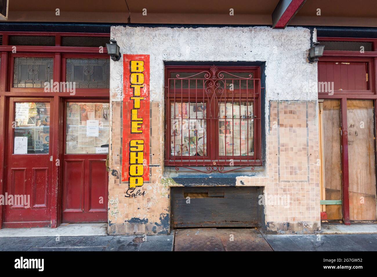 A faded bottle shop sign on the outside of the now permanently closed ...