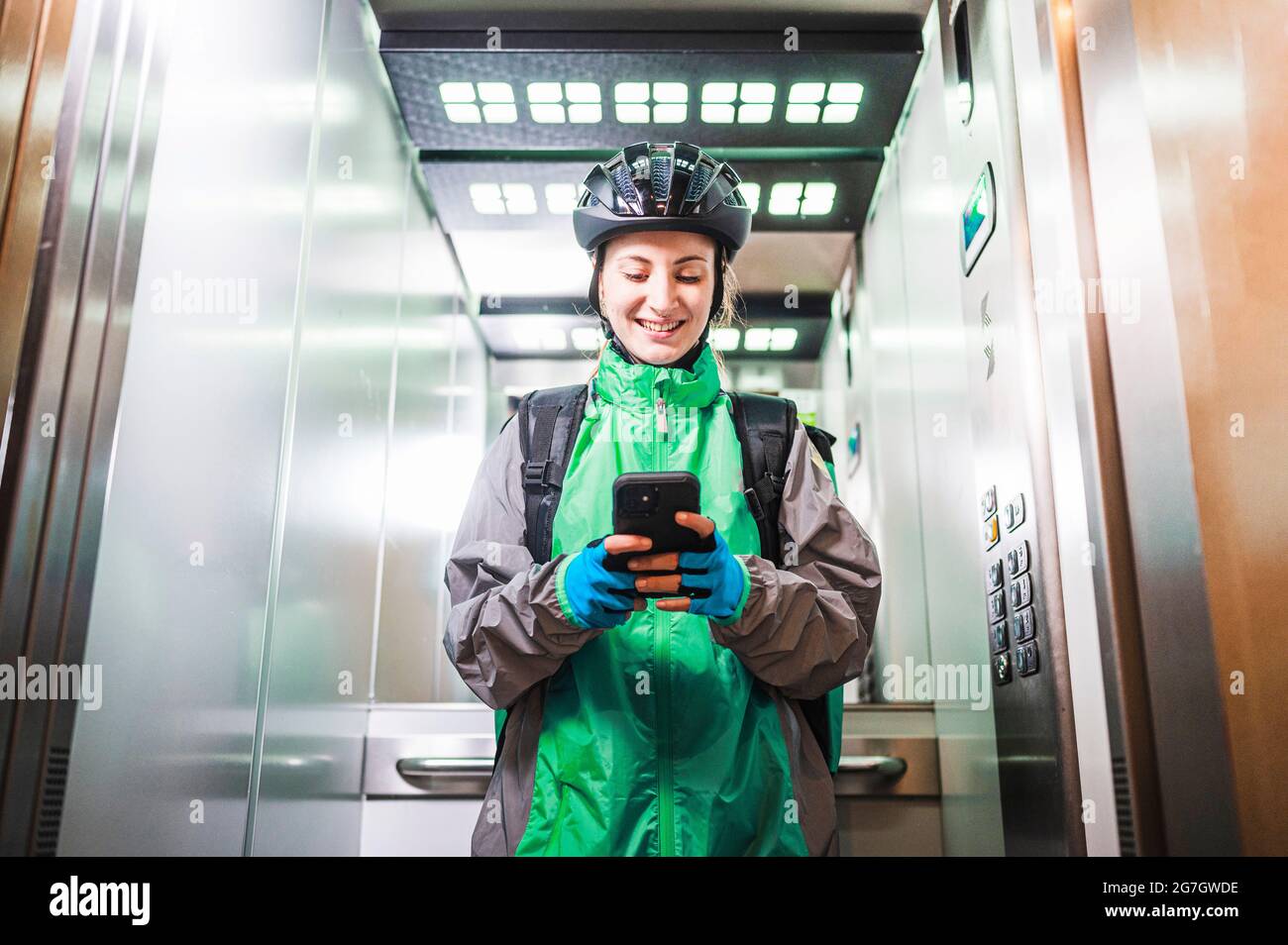 Work woman elevator hi-res stock photography and images - Alamy