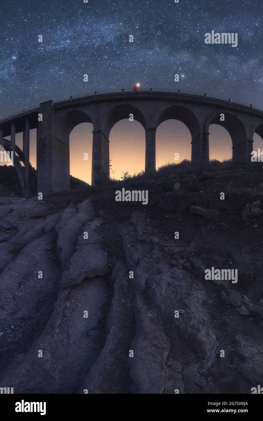 Amazing scenery of aged stone bridge with arched elements crossing ...