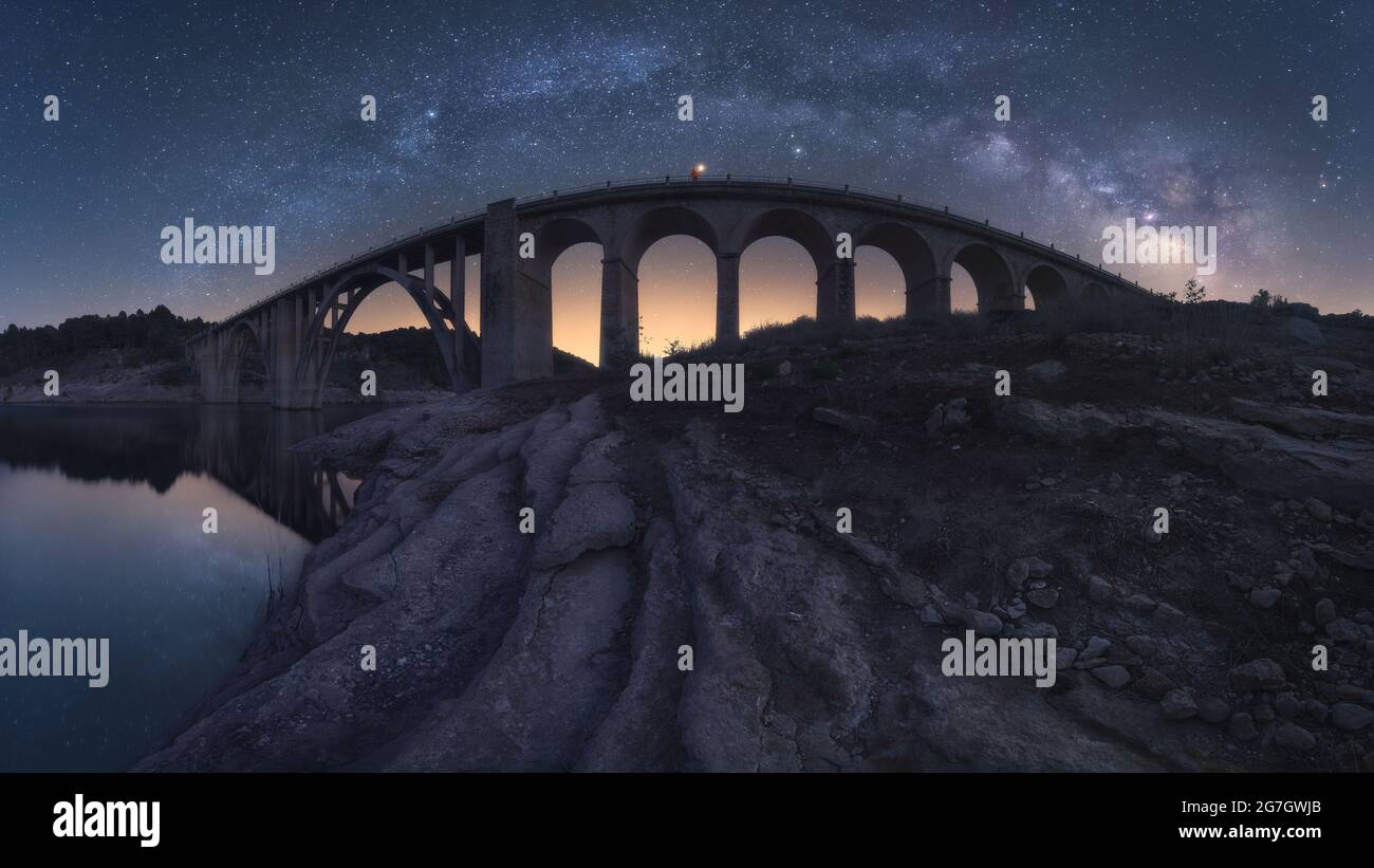 Amazing scenery of aged stone bridge with arched elements crossing ...