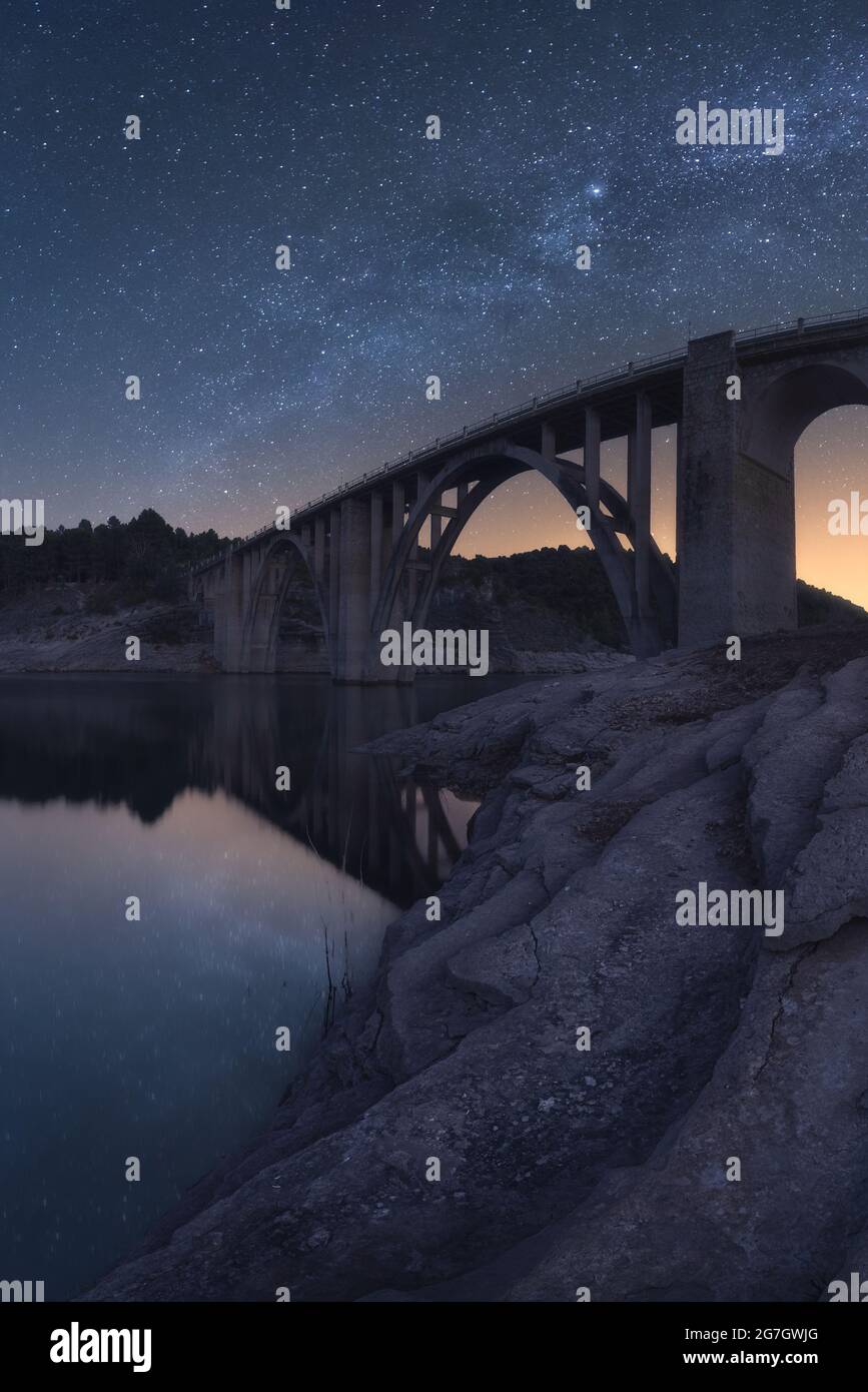 Amazing scenery of aged stone bridge with arched elements crossing ...