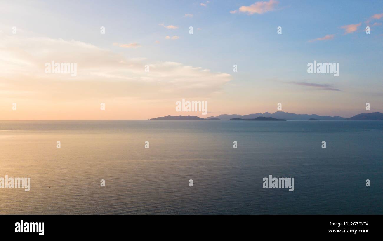 A soft sun setting view of the ocean Stock Photo - Alamy