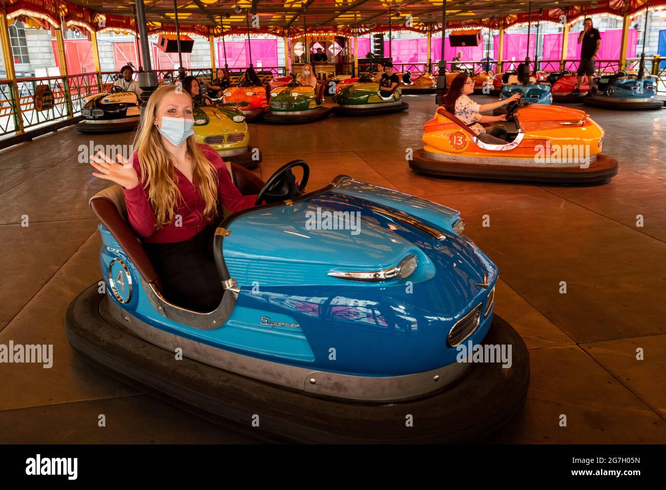 London, UK. 13 July 2021. Visitors having fun on the ride at a preview ...