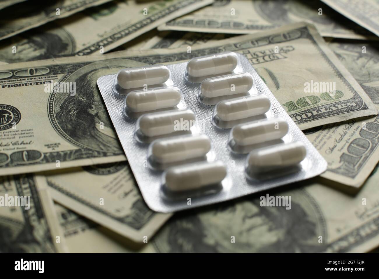 Packaging with white antiviral pills against a background of one ...