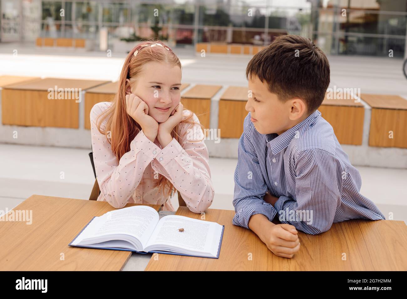 Two Kids Talking At School