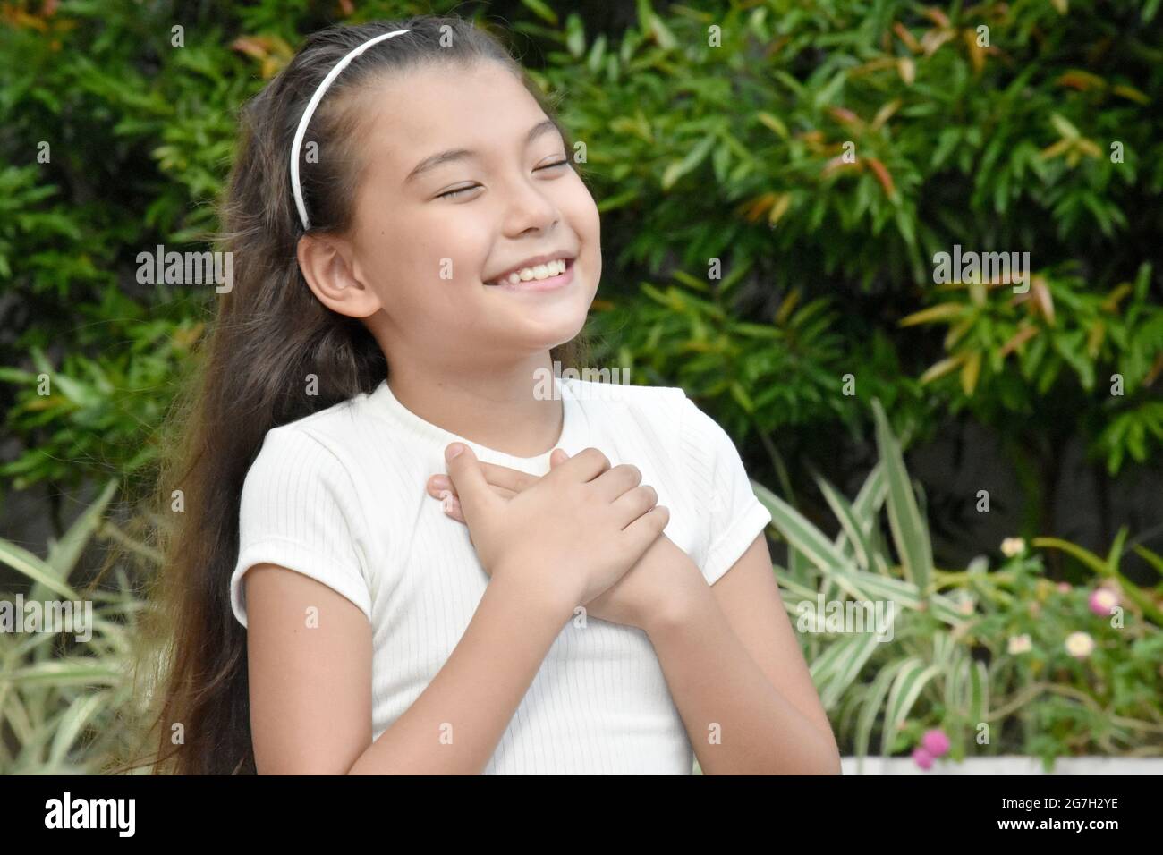 An Appreciative Diverse Female Kid Outdoors Stock Photo - Alamy