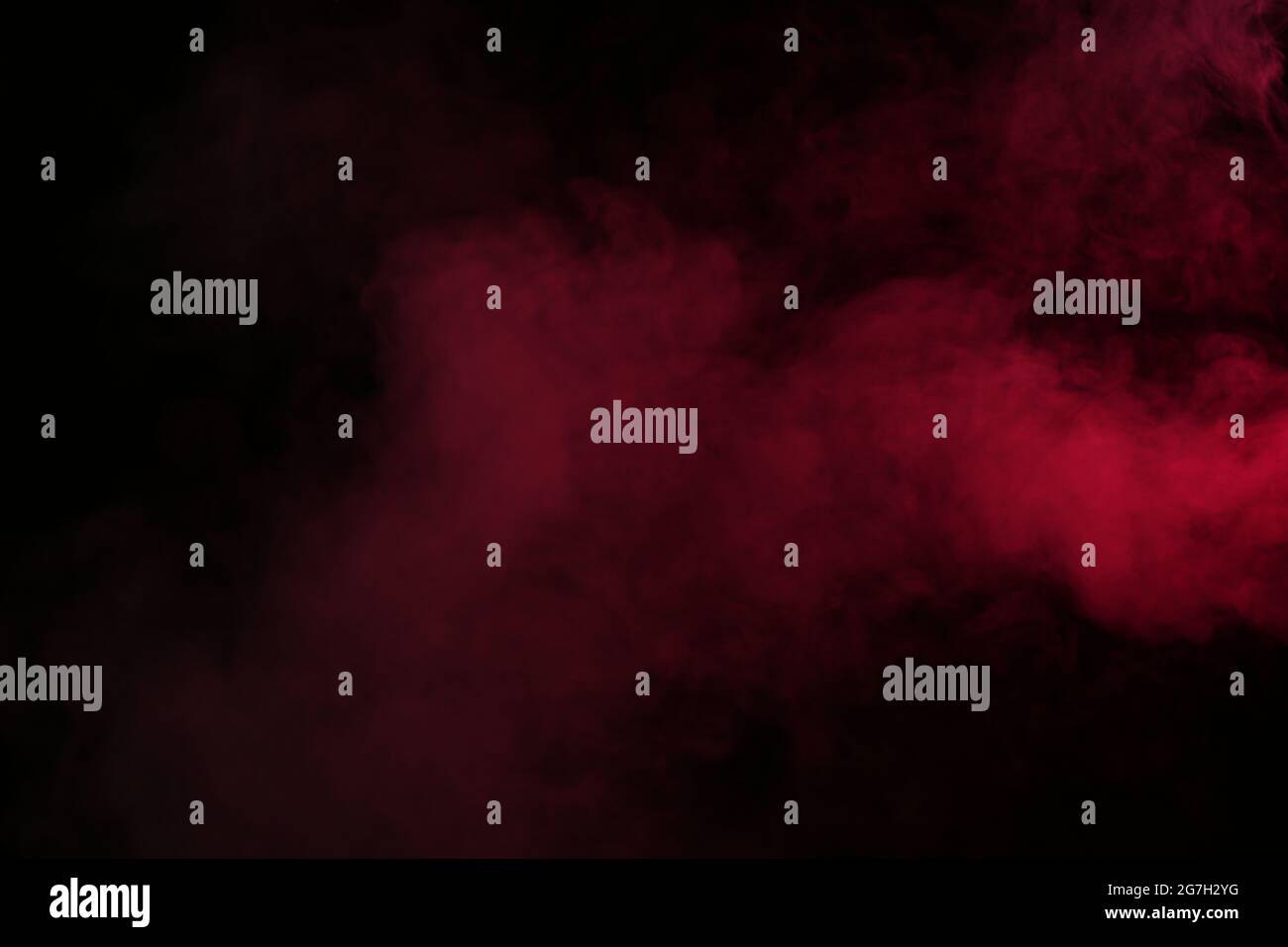Smoke in red light on black background Stock Photo - Alamy