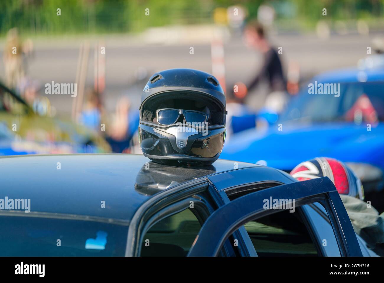 Street racing car with helmet Stock Photo - Alamy