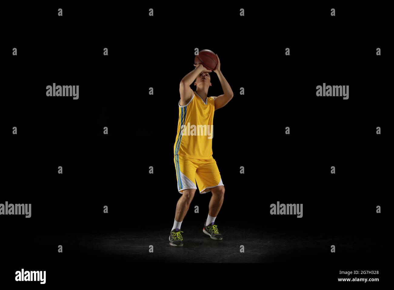 Three-point shot. Basketball player with a ball training isolated on ...