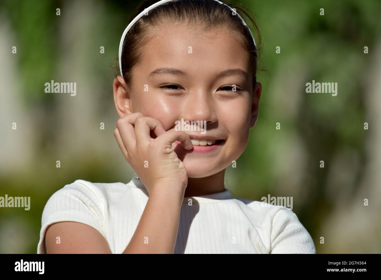 A Cute Asian Children Thinking Outside Stock Photo - Alamy