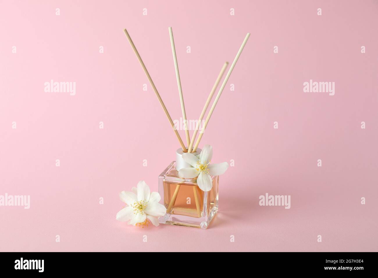 Aroma scent diffuser and flowers on pink background Stock Photo - Alamy