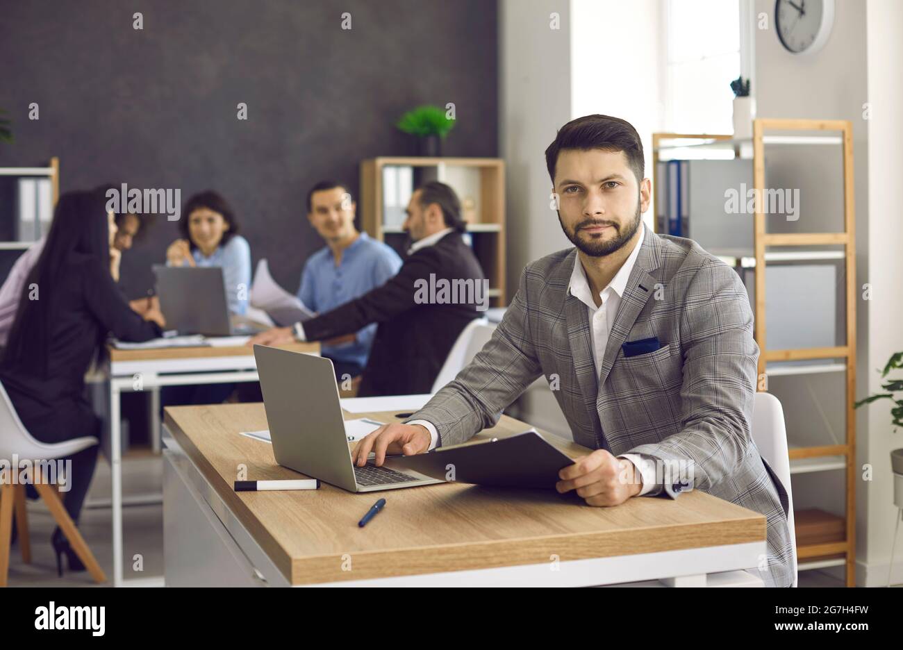 Portrait serious boss sitting table hi-res stock photography and images ...