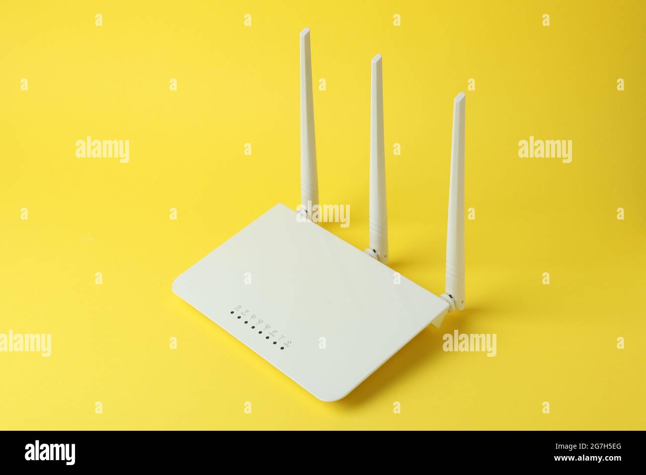 Wi-Fi router with external antennas on yellow background Stock Photo ...