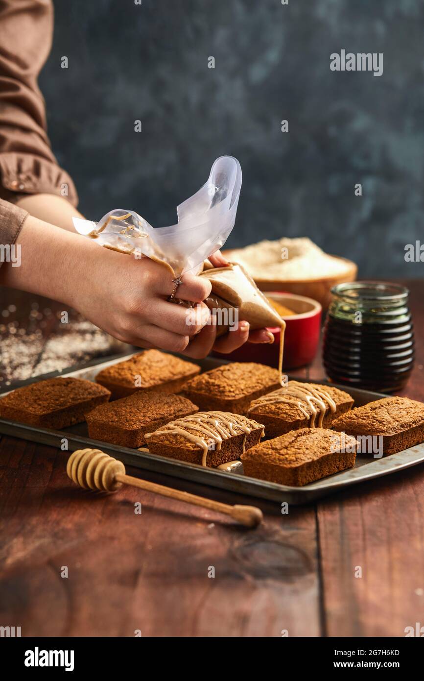 Shot of chef's hand making honey cake Stock Photo - Alamy