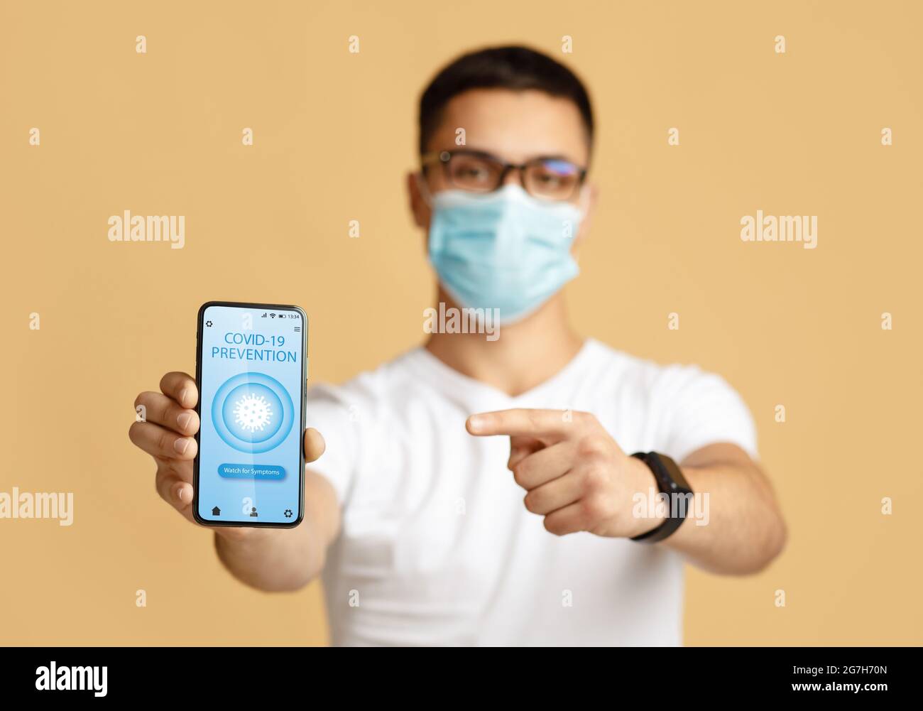 Coronavirus Prevention, Covid Symptom Checker. Young guy in medical ...