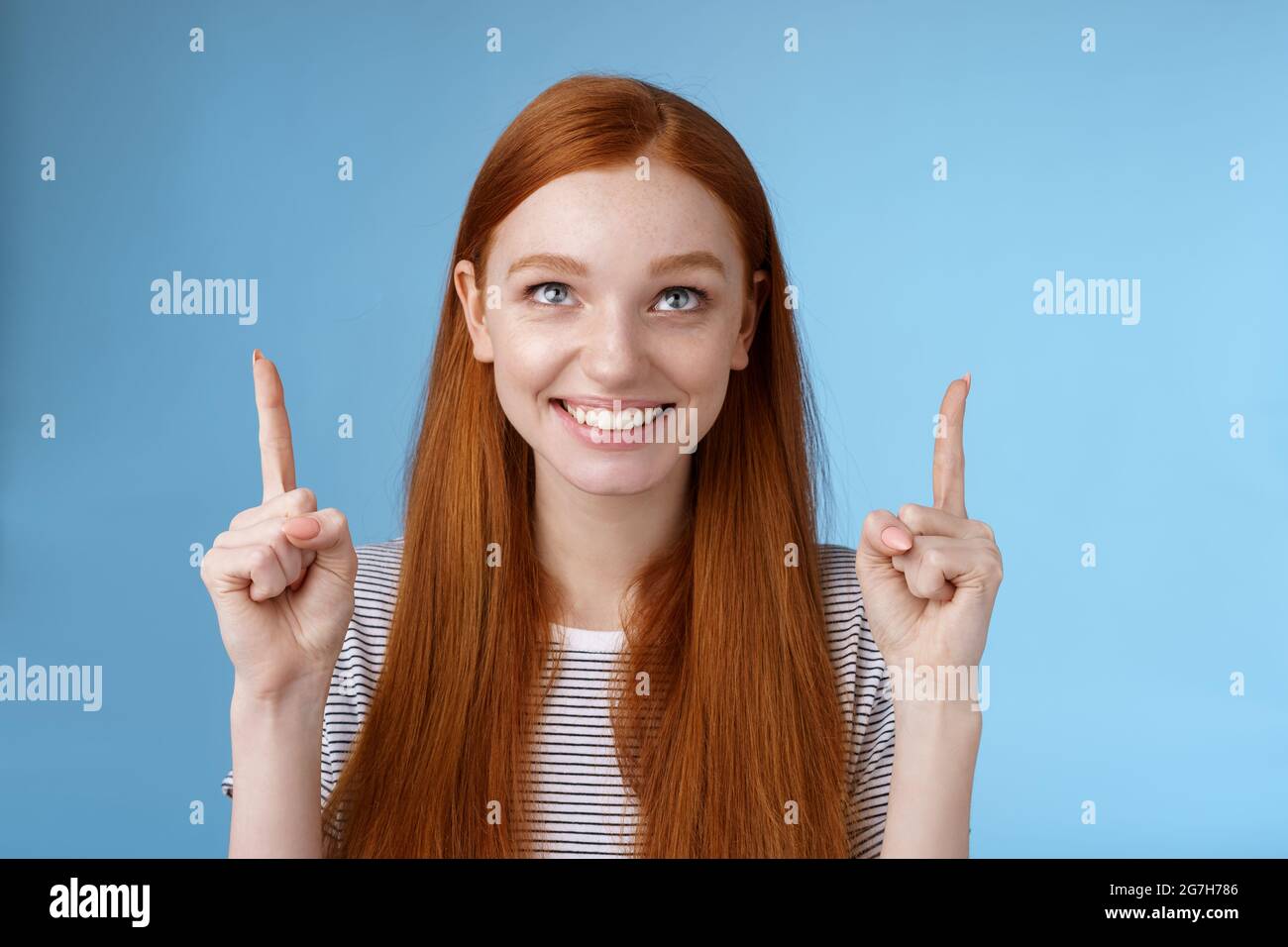 Cheerful curious amused happy entertained redhead pretty girl gazing ...