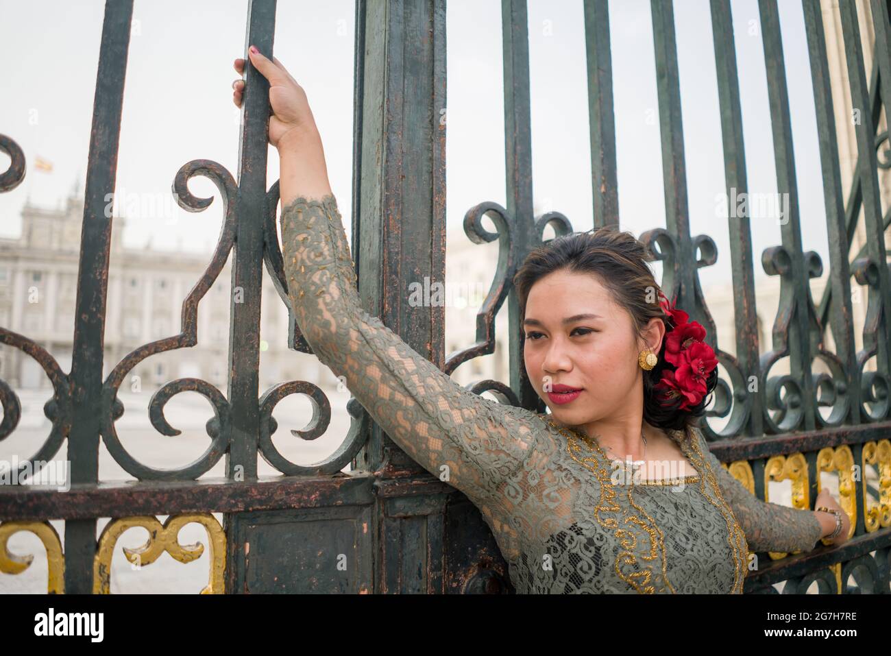 young happy Indonesian woman from Bali having vacation in Europe ...