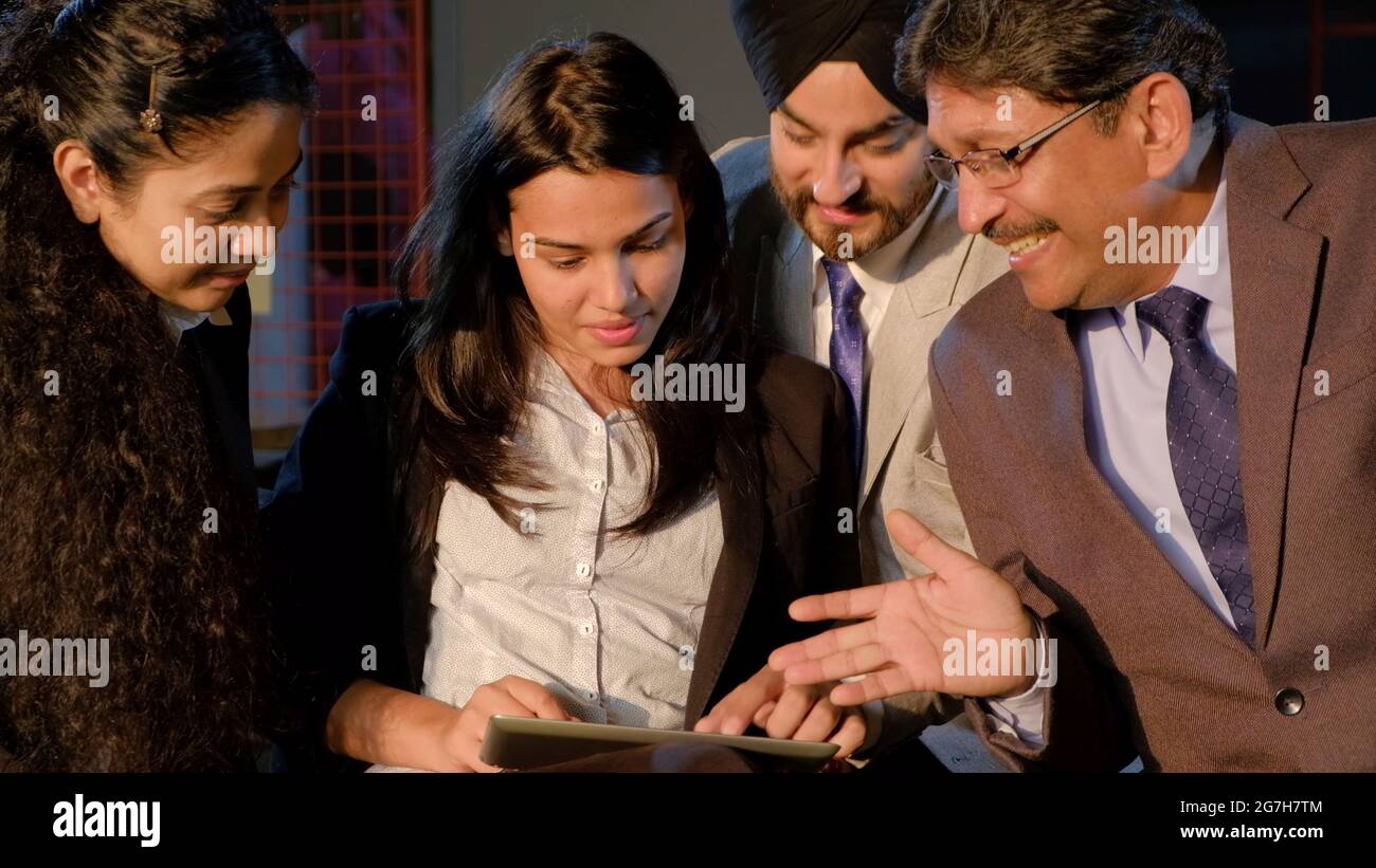 South Asian partners from India having a team meeting Stock Photo - Alamy