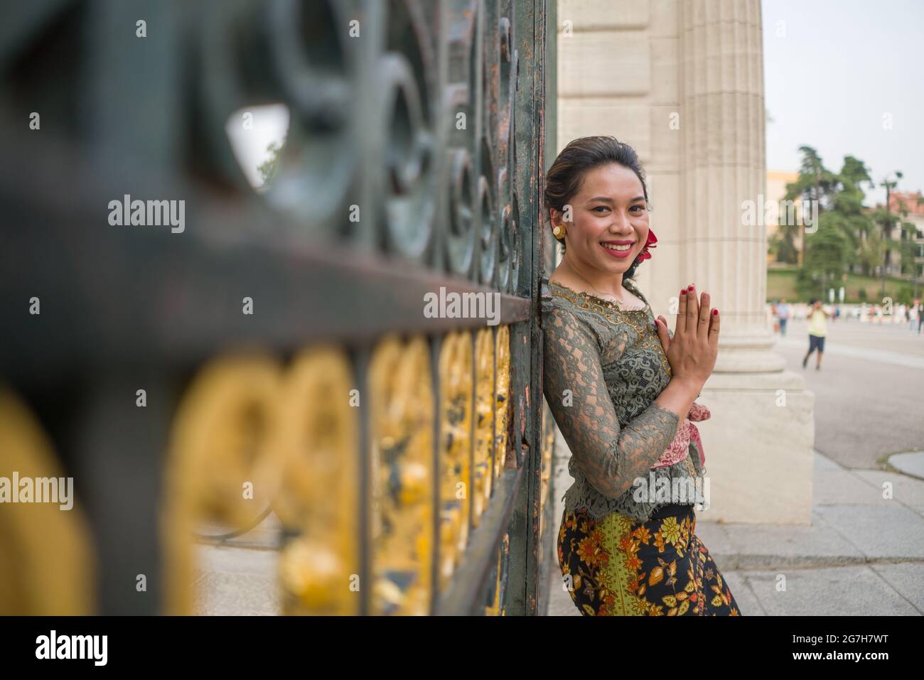 young happy Indonesian woman from Bali having vacation in Europe ...