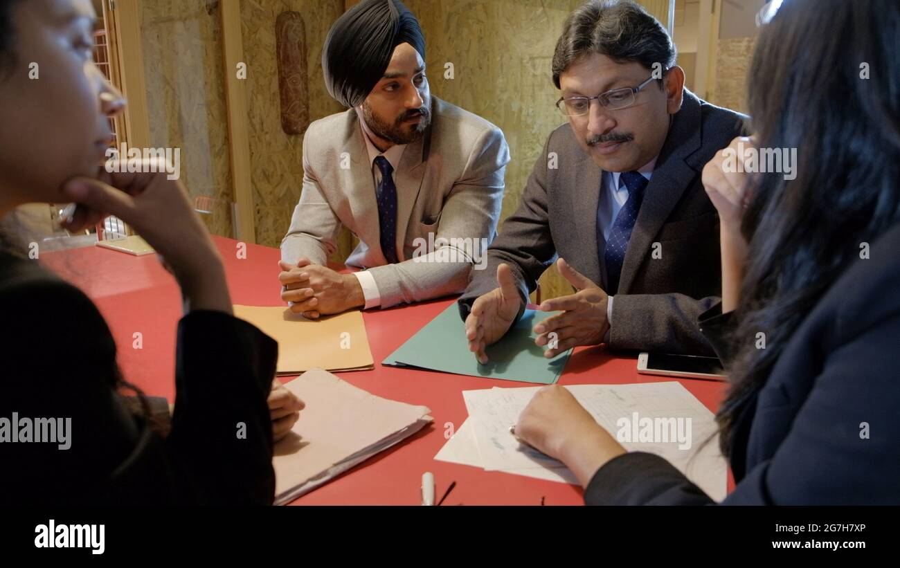South Asian partners from India having a team meeting Stock Photo - Alamy