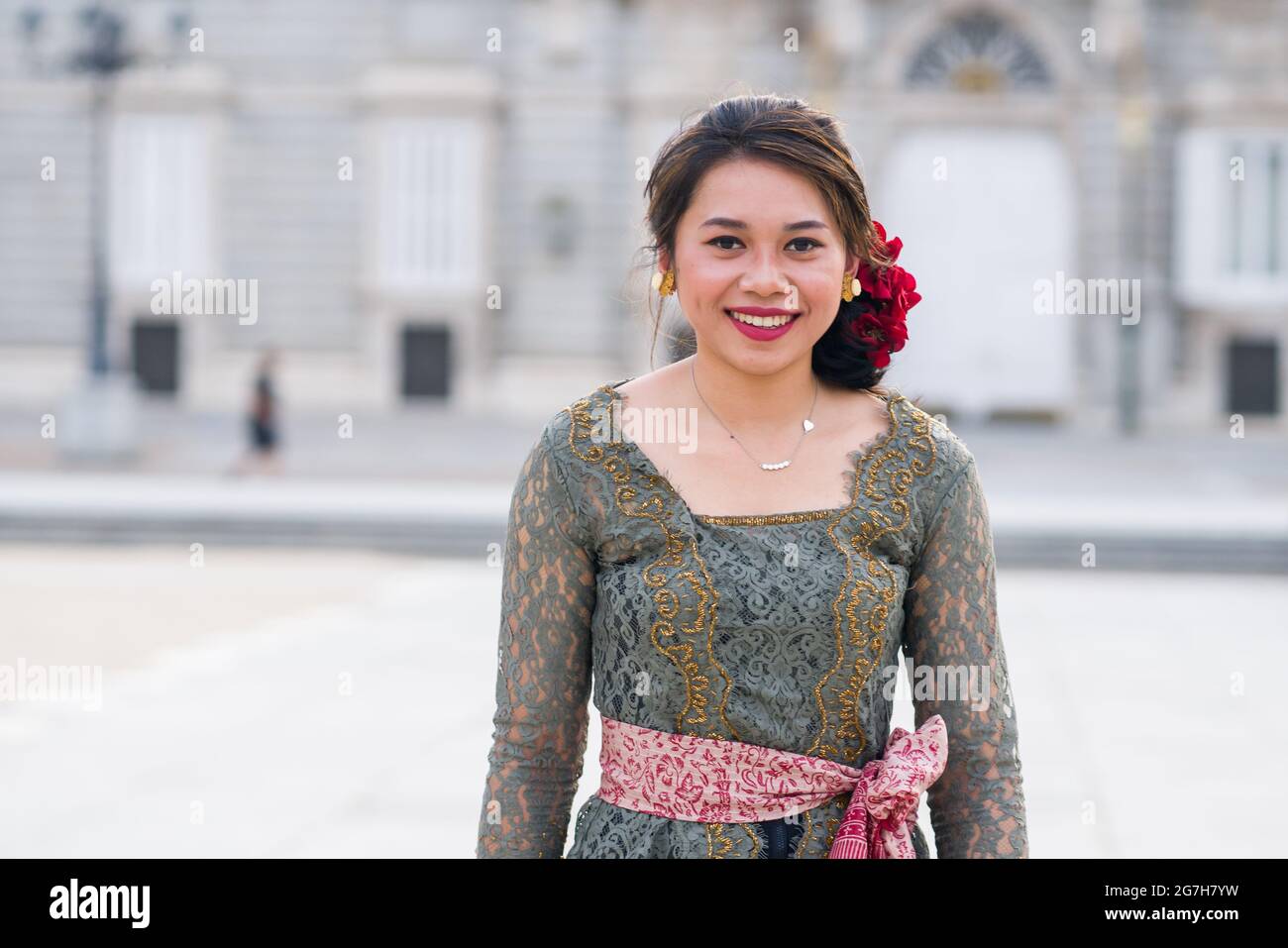 young happy Indonesian woman from Bali having vacation in Europe ...